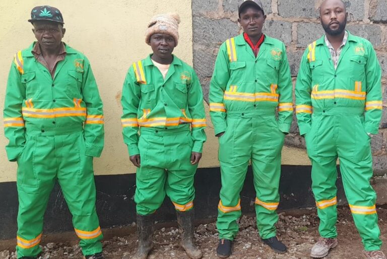 Green overall with orange reflectors - Tekiria General Suppliers LTD